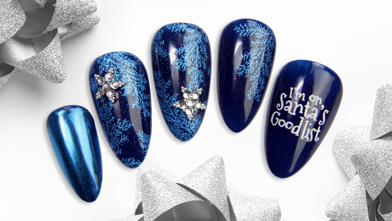 Elegant Blue Winter Nail Art with Frost Patterns and Sparkling Star ...